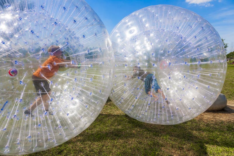 Children Have Fun in the Zorbing Ball Stock Image - Image of caucasian ...