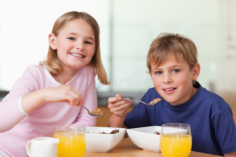 Children having breakfast stock photo. Image of kitchen - 22371734