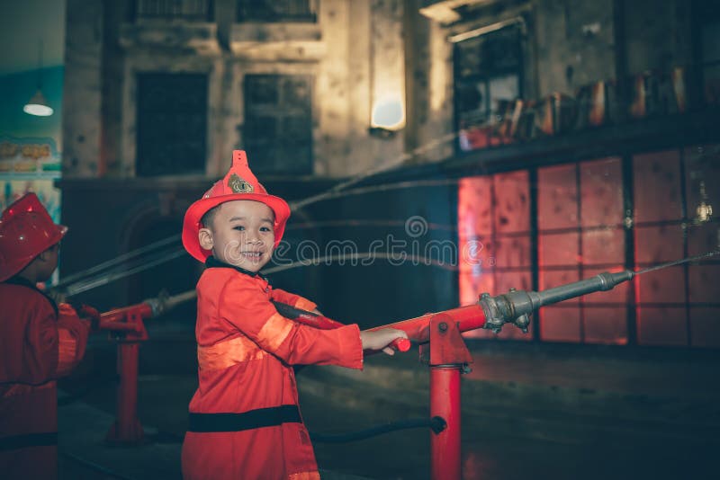 Children Having Fun in Indoors Playground As the Fireman Stock Image ...