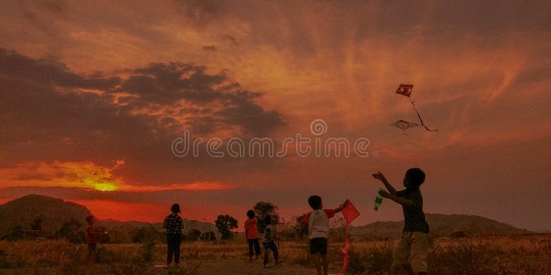 Children Having Fun Playing Kites in Sunset Editorial Stock Image ...