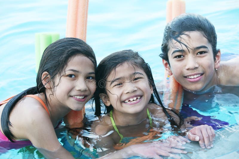 Children Having Fun in Pool Stock Photo - Image of brother, family: 9574002