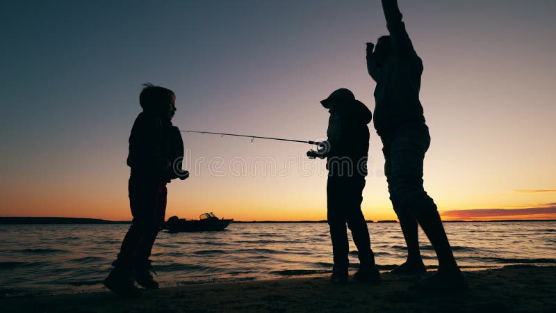 Children are Having Fun with Their Dad while Fishing Stock Video ...