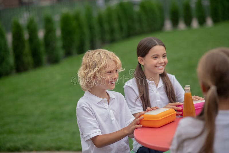 Children Having Lunch Together and Looking Joyful Stock Photo - Image ...