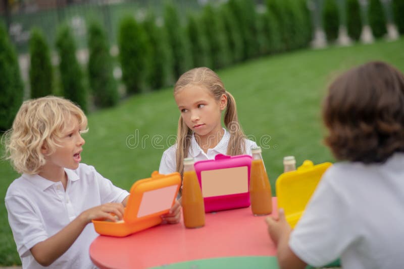Children Having Lunch Together and Talking Seriously Stock Photo ...