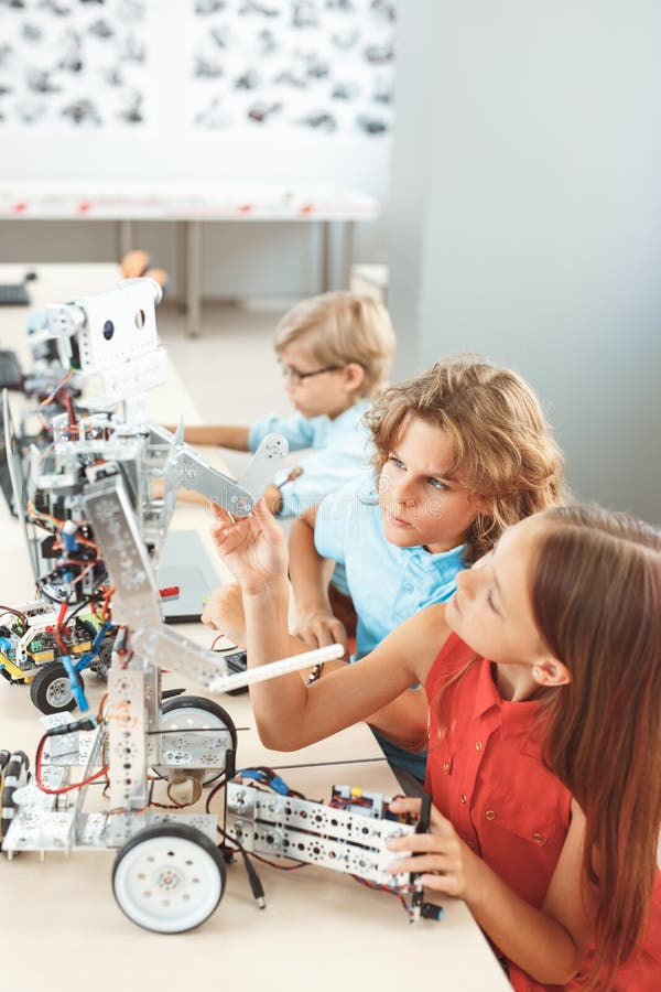 Robotics. Children Sitting Having Class Fixing Robot Concentrated Stock ...