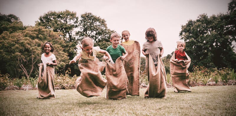 Children having sack race stock photo. Image of childhood - 142591008
