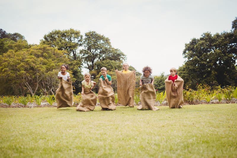 Children Having a Sack Race Stock Image - Image of cheerful, playful ...