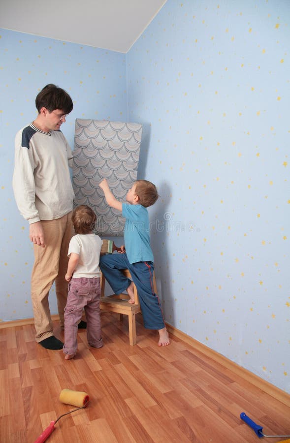 Children Help Father To Glue Wall-papers Stock Image - Image of ...