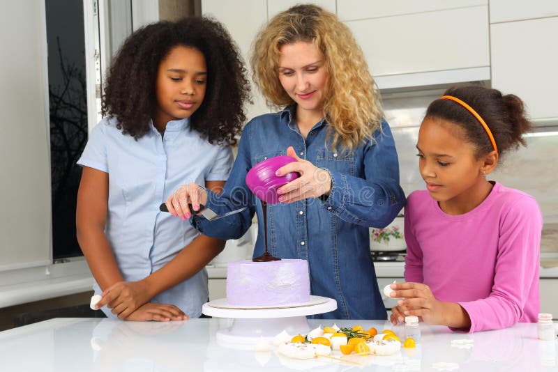 Children Help Mom Decorate the Cake Stock Photo - Image of bake, cake ...