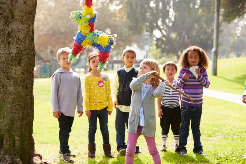 Children Hitting Pinata at Birthday Party Stock Image - Image of asian ...