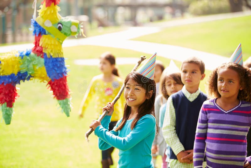 Children Hitting Pinata at Birthday Party Stock Image - Image of garden ...