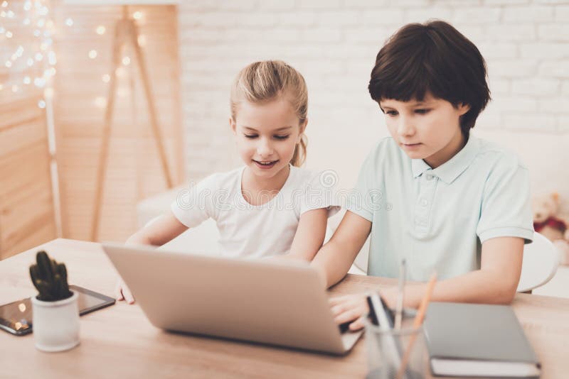 Brother and Sister are Using Laptop for Homework. Stock Image - Image ...
