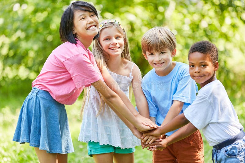 Children Stack Hands for Integration Stock Image - Image of elementary ...
