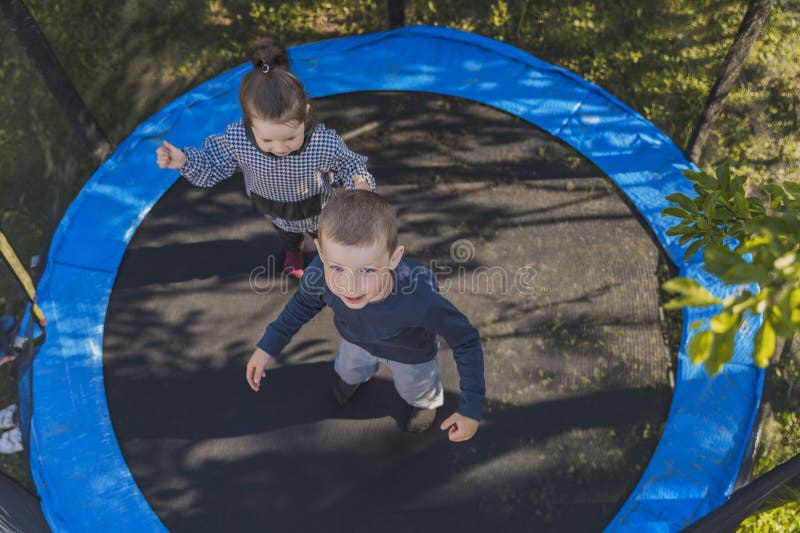 Children Jump on the Trampoline Stock Photo - Image of play, extreme ...
