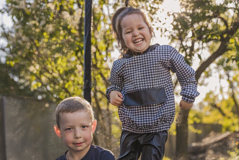 Children Jump on the Trampoline Stock Photo - Image of entertainment ...