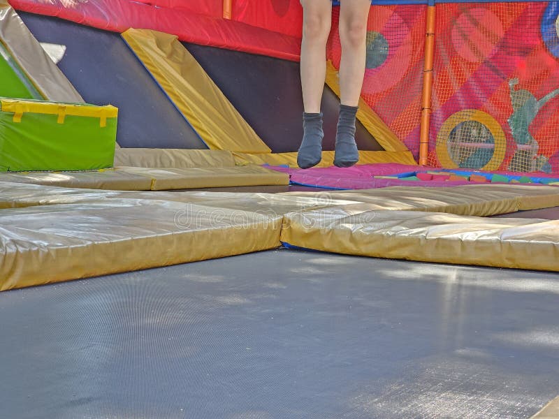 Children Jumping on Trampoline and Having Fun in Park Stock Photo ...