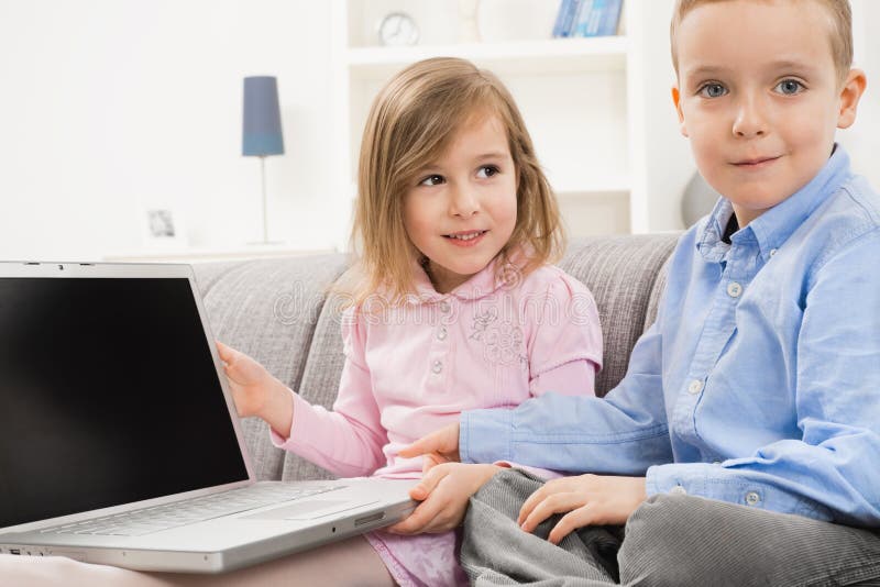 Happy children with laptop stock photo. Image of interior - 9797280
