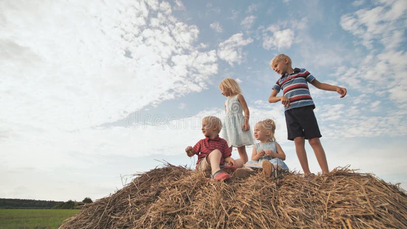 Children Launch Airplanes Standing on a Stack of Straw. Stock Video ...
