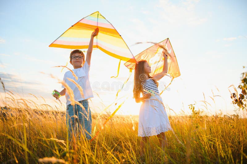 Children Launch a Kite in the Field at Sunset Stock Image - Image of ...