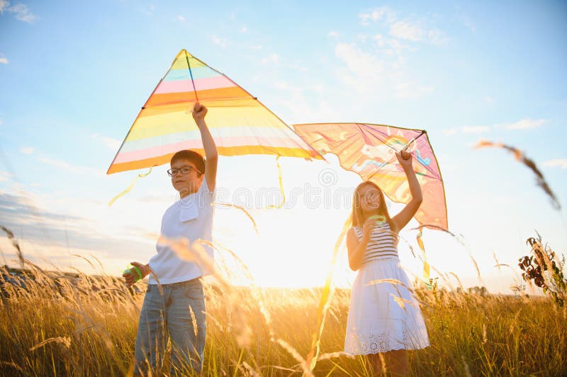 Children Launch a Kite in the Field at Sunset Stock Image - Image of ...