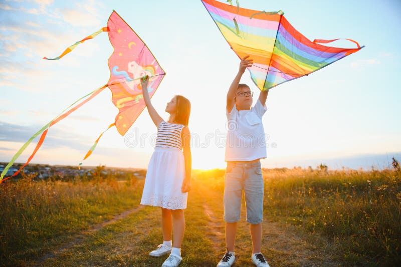 Children Launch a Kite in the Field at Sunset Stock Image - Image of ...