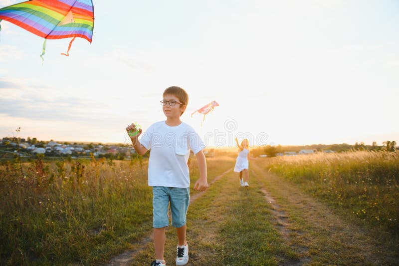 Children Launch a Kite in the Field at Sunset Stock Image - Image of ...