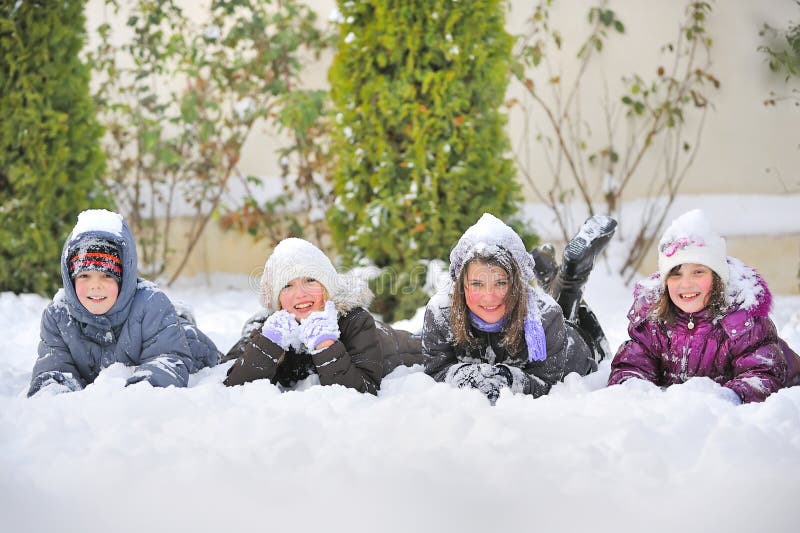 Children Laying on snow stock image. Image of old7, chilly - 17482099