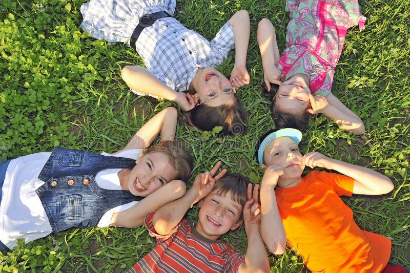 Children Laying Together on Ground Stock Image - Image of cute, males ...