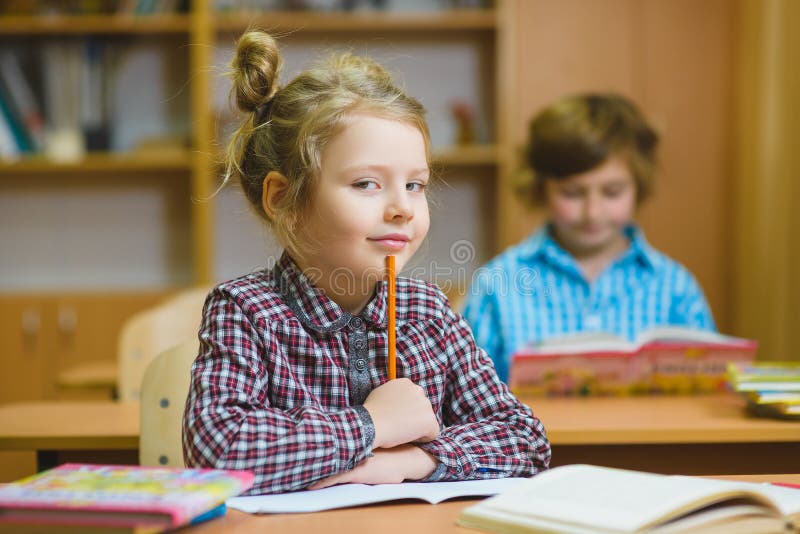 Children Learning and Doing Homework in School Classroom Stock Photo ...