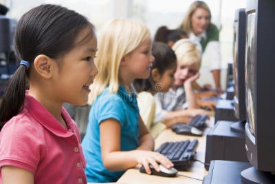 Children Learning How To Use Computers. Stock Photo - Image of ...
