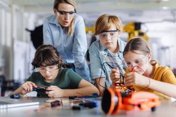 Children Learning Robotics in Elementary School. Young Students ...