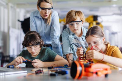 Children Learning Robotics in Elementary School. Young Students ...