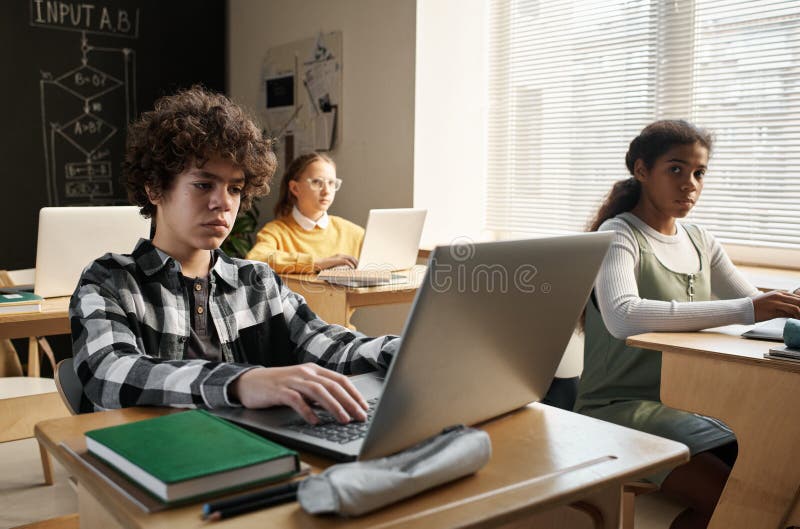 Children Learning To Use Computer at Lesson Stock Image - Image of ...