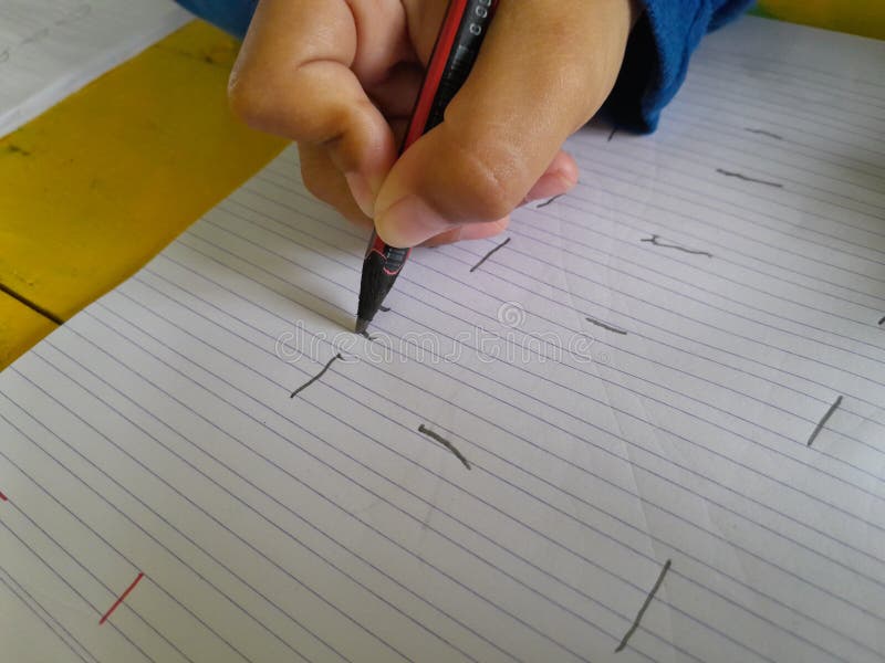 A Children in Learning To Write a Line Stock Photo - Image of ...
