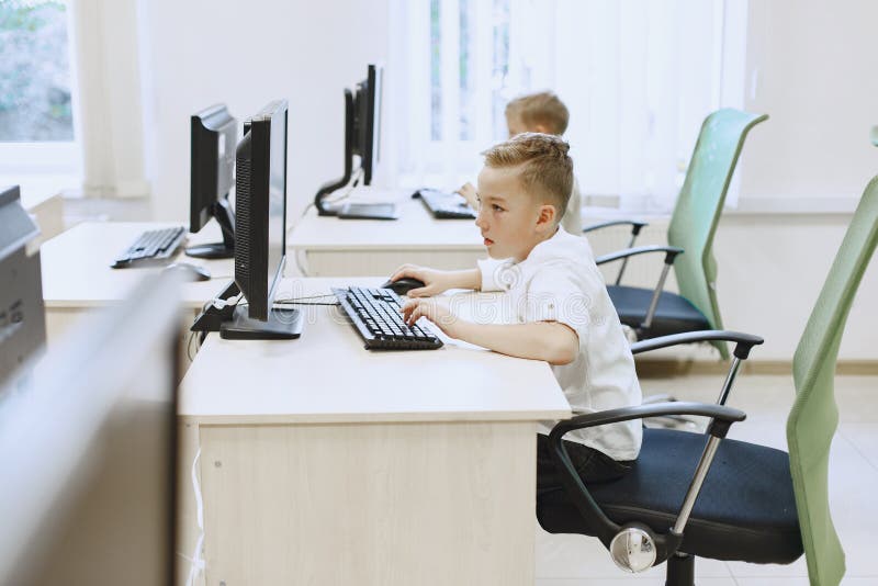 Boys are Sitting at Computers in the Classroom Stock Image - Image of ...