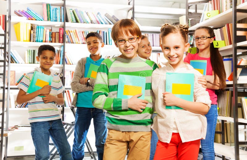 Children in Library Hold Exercise Books and Stand Stock Image - Image ...