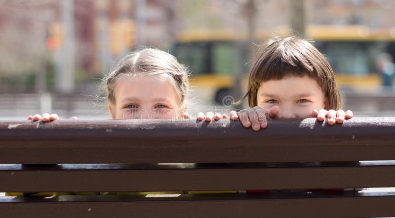 Children Look Out of Back Street Bench Stock Photo - Image of length ...
