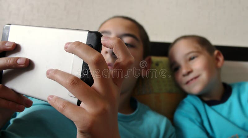 Children Look at the Tablet. Stock Photo - Image of children, emotions ...