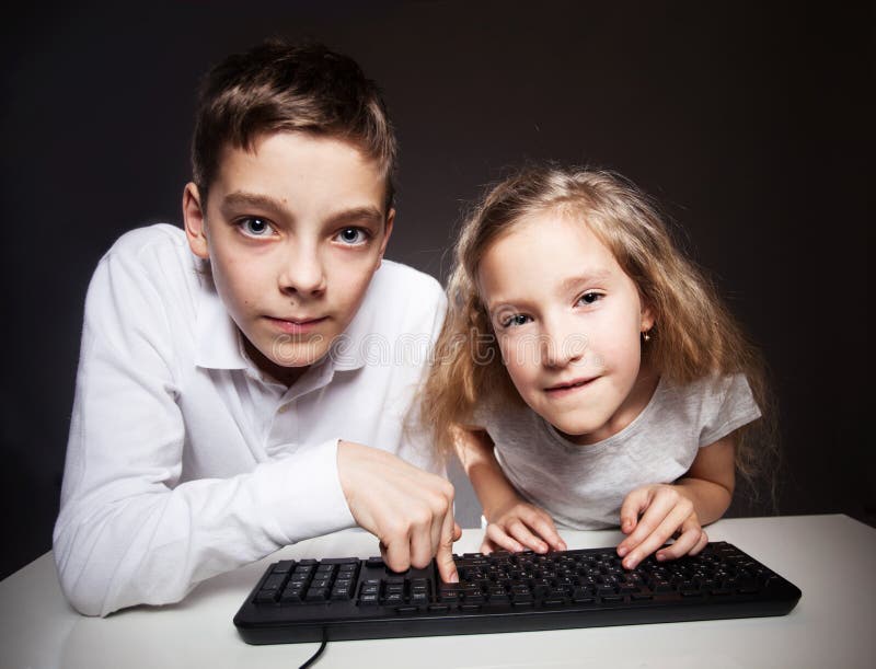 Children Looking at a Computer Stock Photo - Image of girls, technology ...