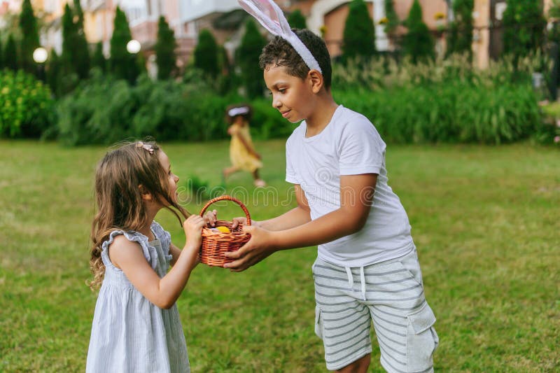 Children are Looking for Hidden Eggs during the Easter Hunt . Stock ...