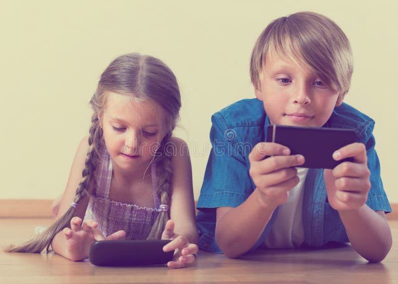 Children Looking at Screen of Smartphones Stock Image - Image of online ...