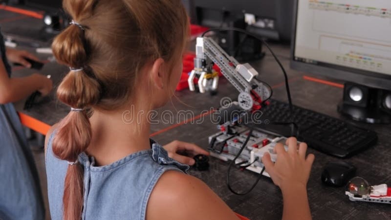 Children Makes a Robot from the Robotic Constructor at the Desk with ...