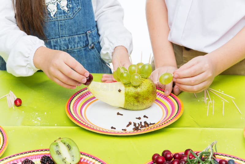 Children Making Fruit Hedgehog Stock Photo - Image of help, cute: 66656164