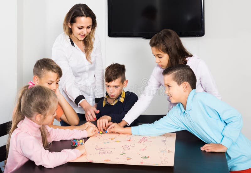 Children Making Move on Pre-marked Surface of Board Game Stock Photo ... Children Making Move on Pre-marked Surface of Board Game Stock Photo ...