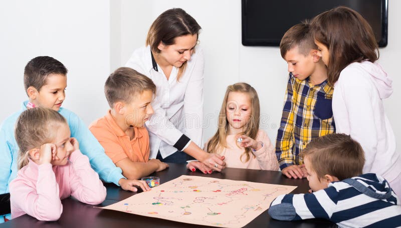 Children Making Move on Pre-marked Surface of Board Game Stock Image ...