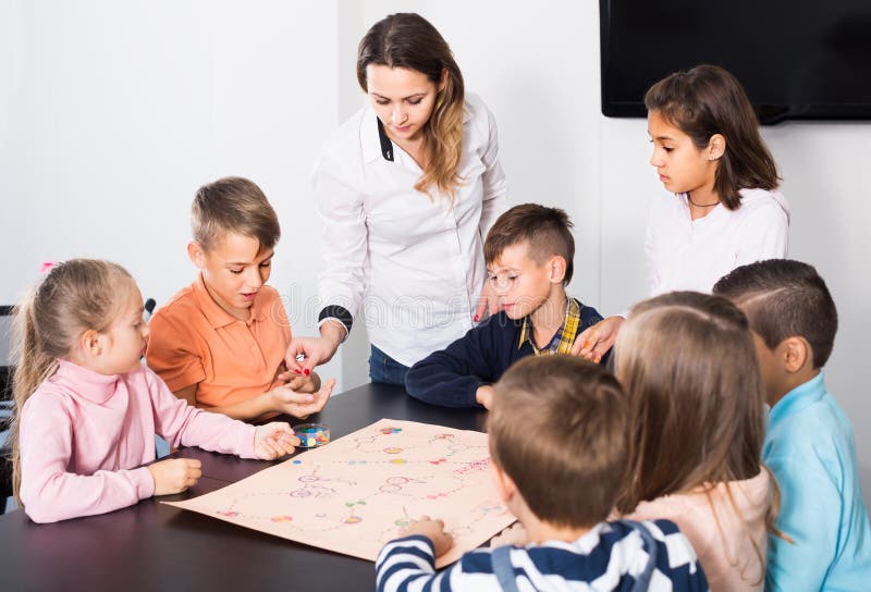 Children Making Move on Pre-marked Surface of Board Game Stock Image ...
