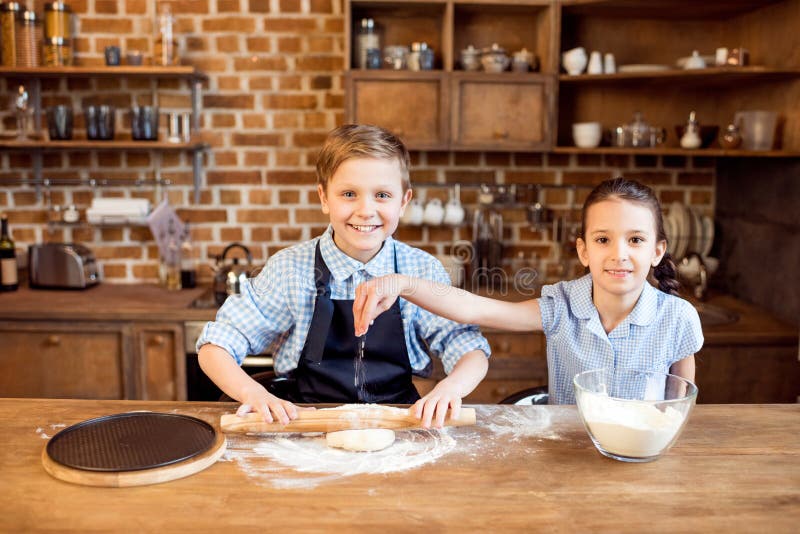Children Making Pizza Dough on Wooden Tabletop Stock Photo - Image of ...