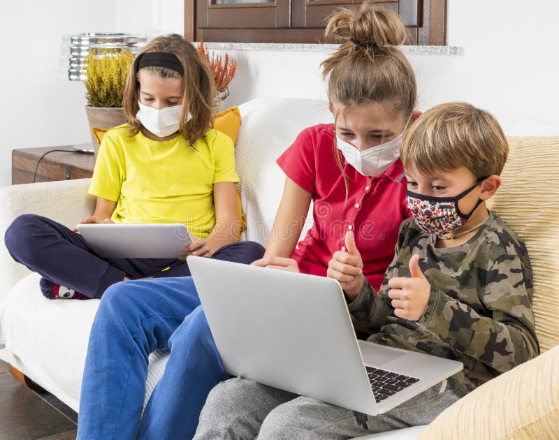 Children Studies at Home, Wear Protective Masks, and Doing School ...
