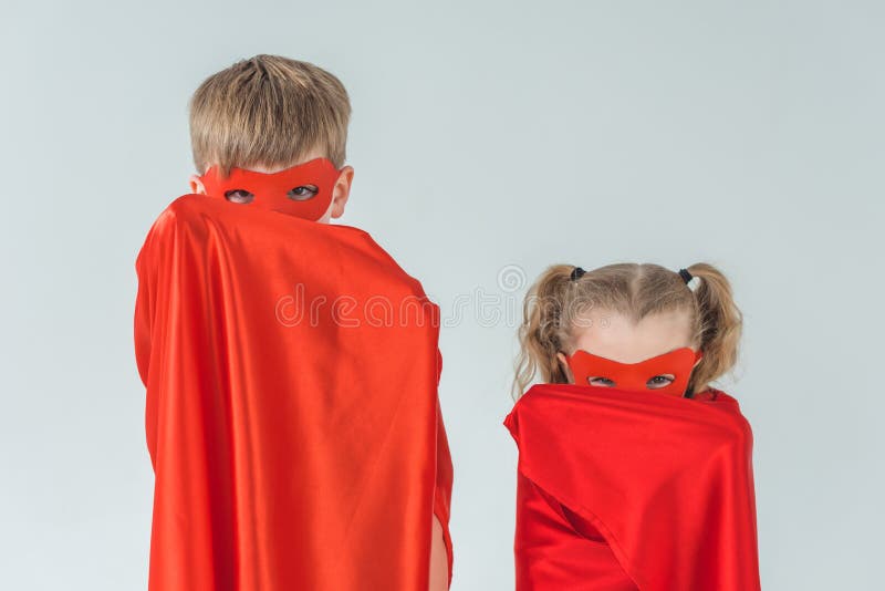 Children in Masks Covering Faces with Cloaks and Looking at Camera ...