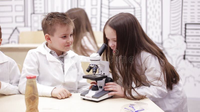 Children with Microscopes at a Biology Class at School Stock Footage ...
